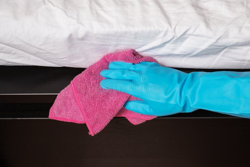 Hand in Glove Wipes Dust from the Bed Stock Image - Image of cleaning ...