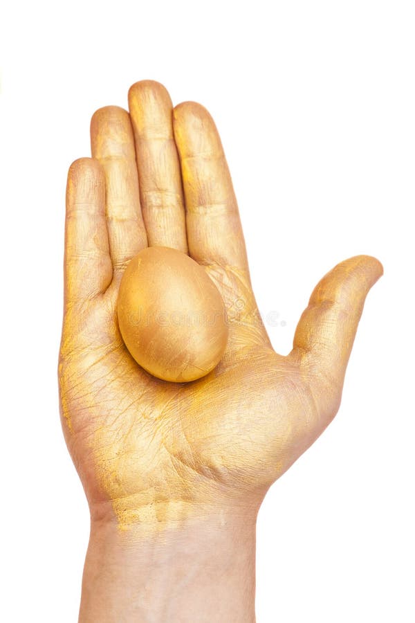Hand with a golden egg stock image. Image of wealth, hand - 56392745