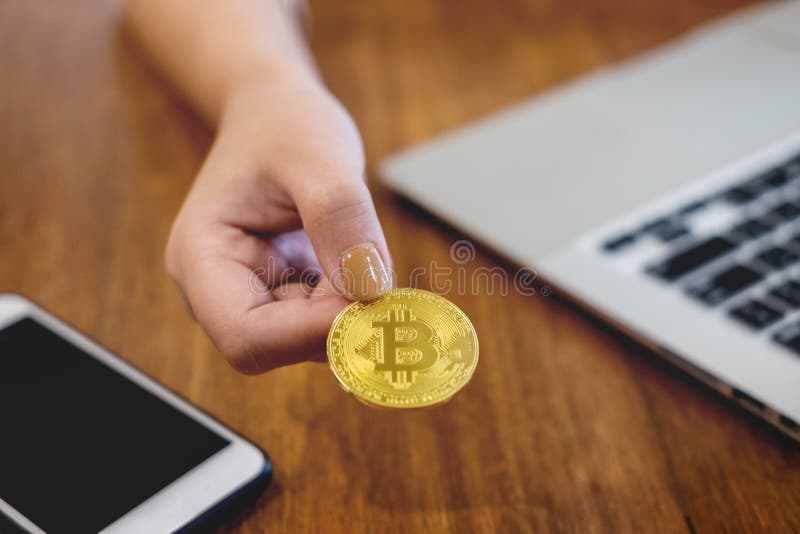 Hand with Golden Metal Bitcoin Crypto Currency Investment- Symbo Stock ... Hand with Golden Metal Bitcoin Crypto Currency Investment- Symbo Stock ...