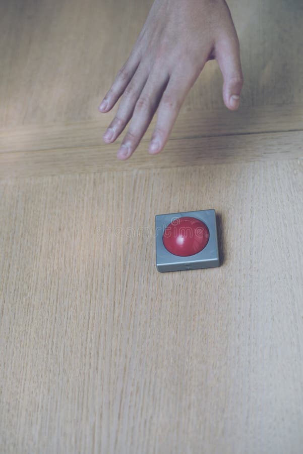 Hand Grab for the Red Button on Wood Table. Stock Photo - Image of ...