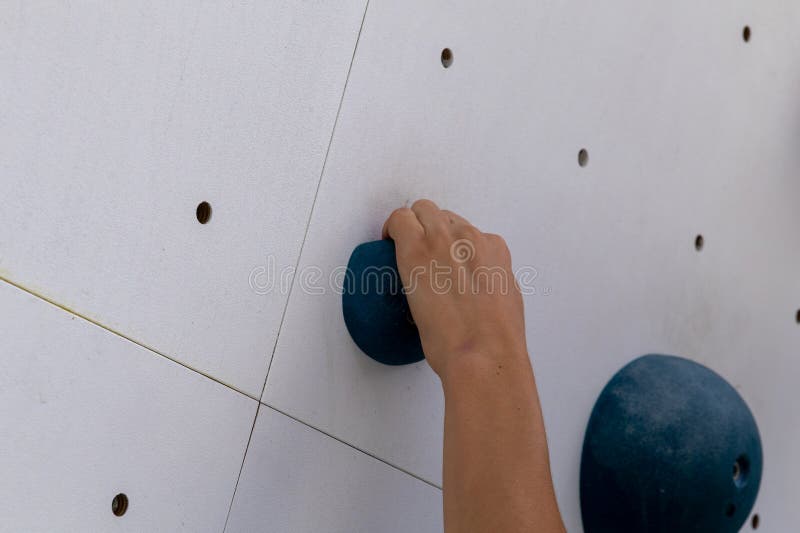 Hand Grabbing Climbing Hold on Artificial Climbing Wall Panel Stock ...
