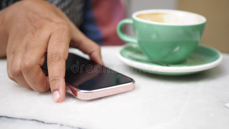A Hand Grabbing and Picking Up Mobile Phone on the Table. Stock Footage ...