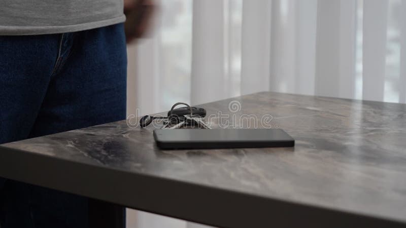 Hand Grabbing Smartphone and Wallet from Table Near Bright Window Stock ...