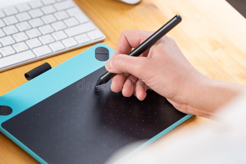 Close-up of Female Hands Using Digital Graphics Tablet and Stylus while ...