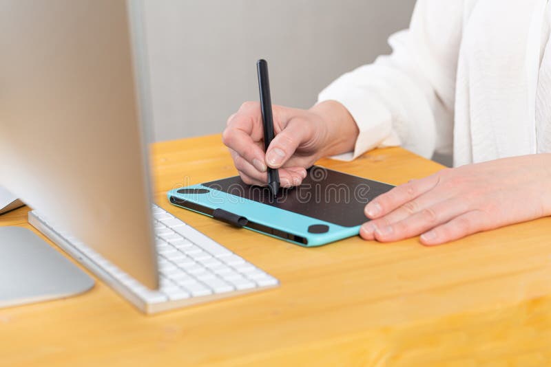 Close-up of Female Hands Using Digital Graphics Tablet and Stylus while ...