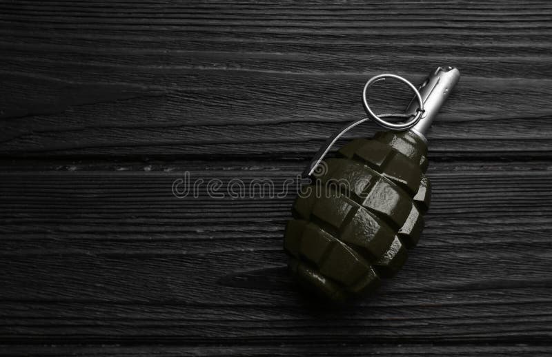 Hand Grenade on Black Wooden Table, Top View. Space for Text Stock ...