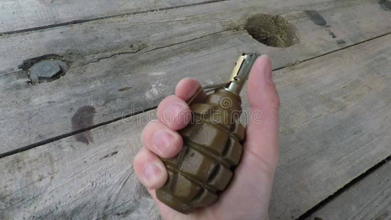The Hand with Grenade Releases the Safety Catch Stock Footage - Video ...