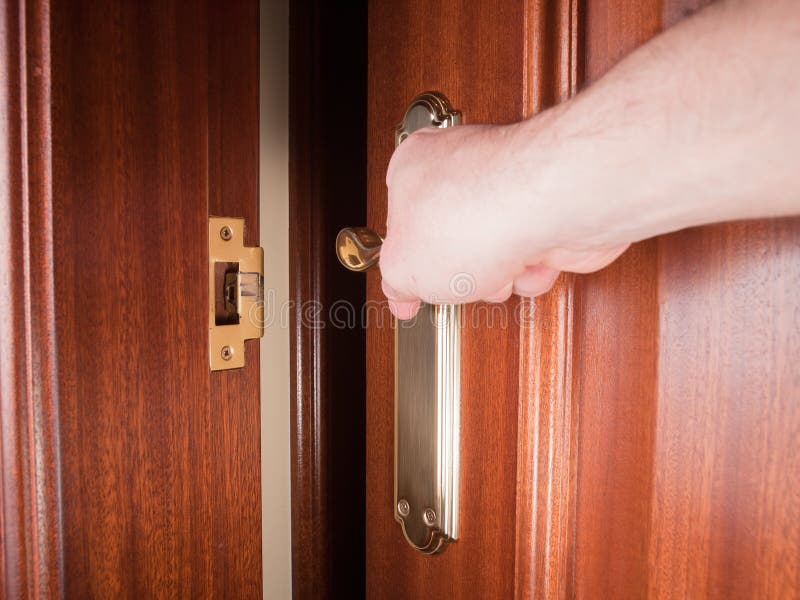 Hand Gripping the Handle of a Door Stock Photo - Image of room, opening ...