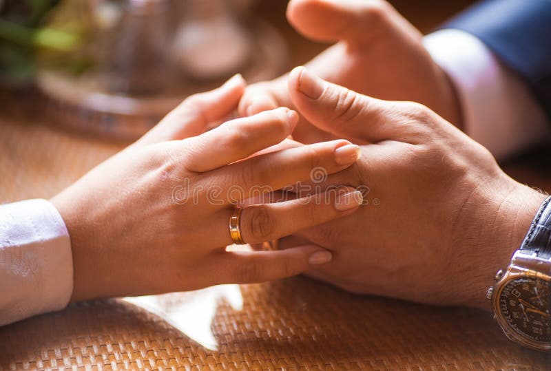 Hand of groom and bride stock image. Image of people - 28639565