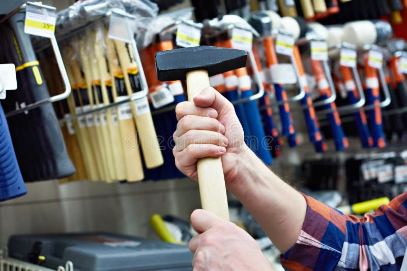 Hand with Hammer in Building Store Stock Image - Image of closeup ...