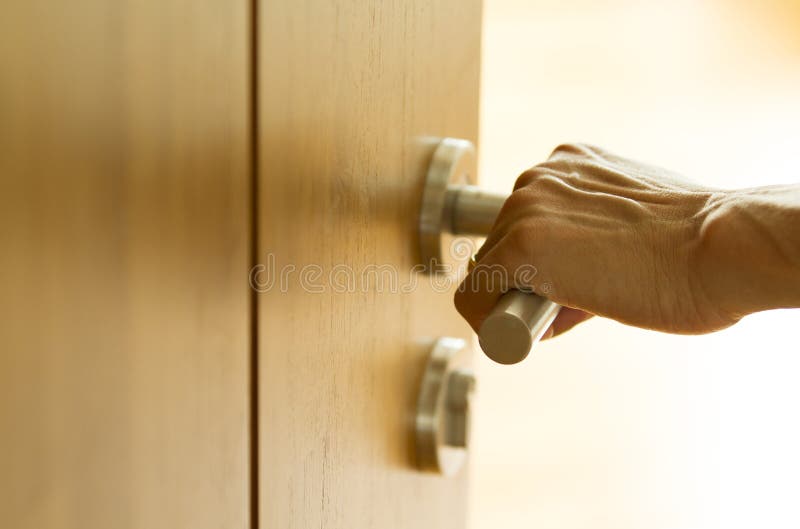 Hand on a Handle Opening Wooden Door Stock Photo - Image of white ...