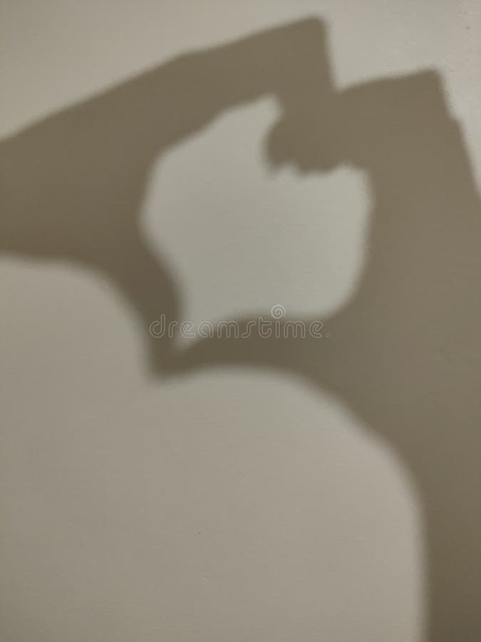 Hand heart shadow on wall stock image. Image of hand - 241600511