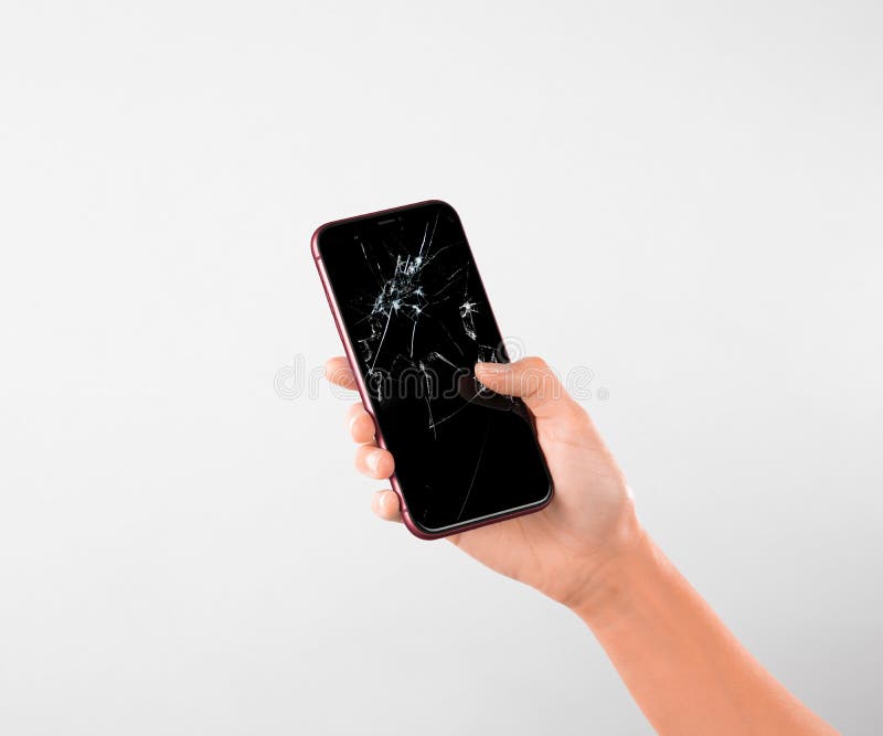 Damaged and Broken Screen Mobile Phones on Pink Background Stock Photo ...