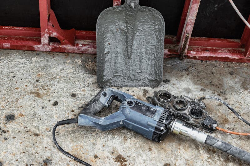 Hand-held Electric Vibrator for Concrete Pouring Work with a Shovel in ...