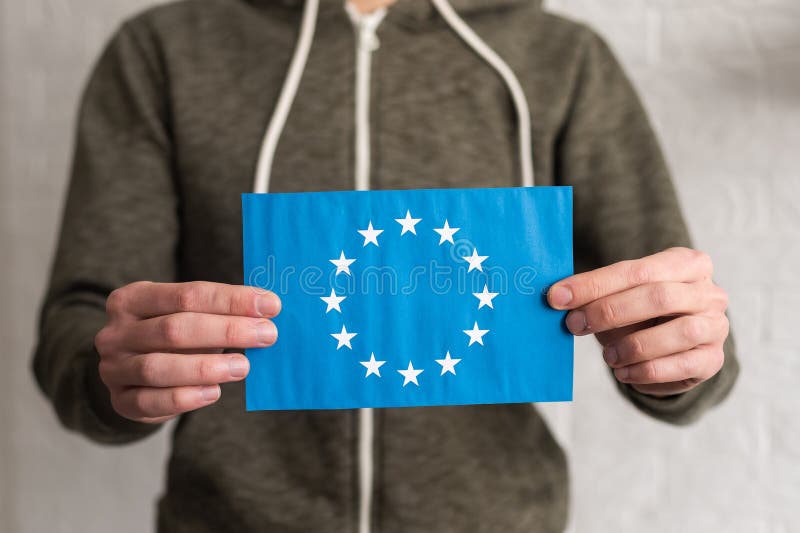 Hand-held Flag of the European Union Stock Photo - Image of waving ...