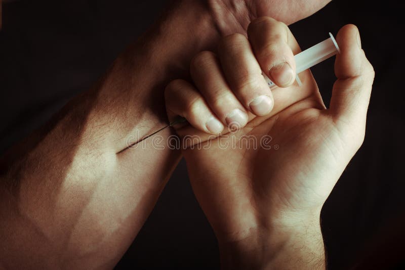 Hand with heroin syringe stock photo. Image of injection - 38227536