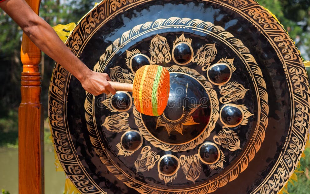 Hand hit gong. stock photo. Image of black, cymbal, hand - 67307656
