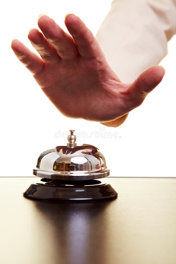 Hand hitting hotel bell stock image. Image of ringing - 15154813
