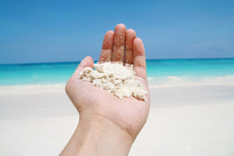 Hand hold beach sand stock image. Image of blue, romantic - 34893921