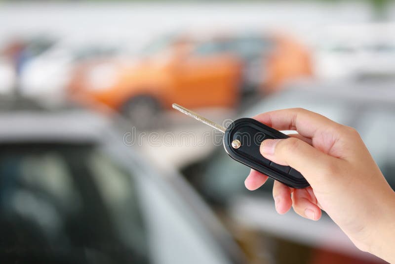 Hand hold car key remote stock photo. Image of human - 76356276
