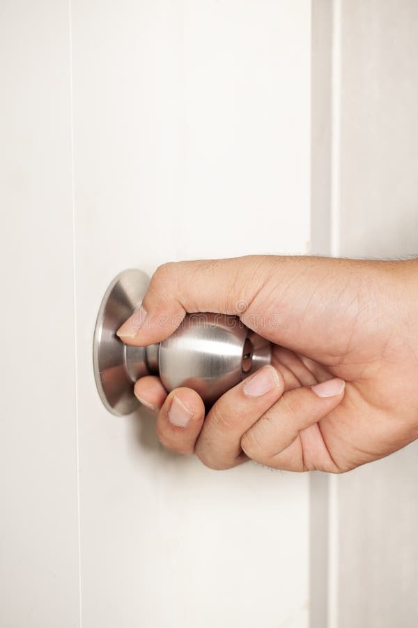 Hand hold handle of door stock photo. Image of room - 267916388