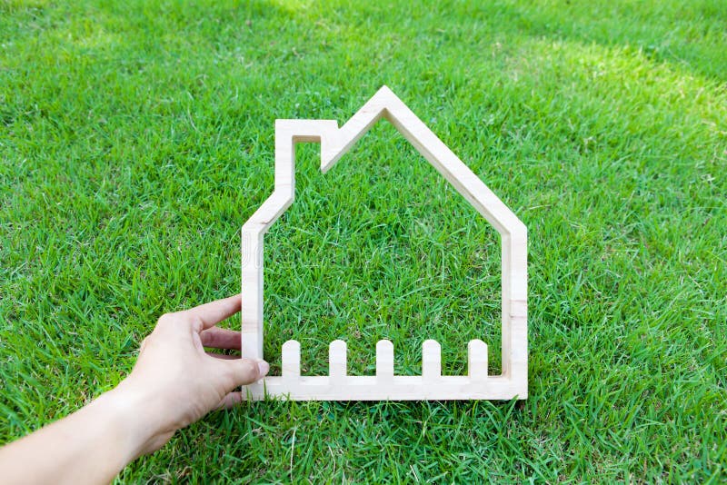 Hand Hold House on Green Field Stock Image - Image of comfort, ideas ...