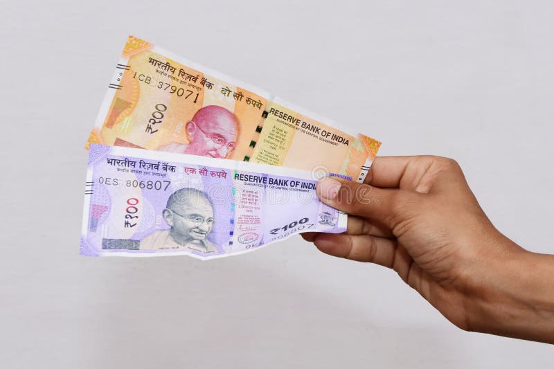 Hand Hold Indian Currencies 100 and 200 Rupee Notes White Background ...