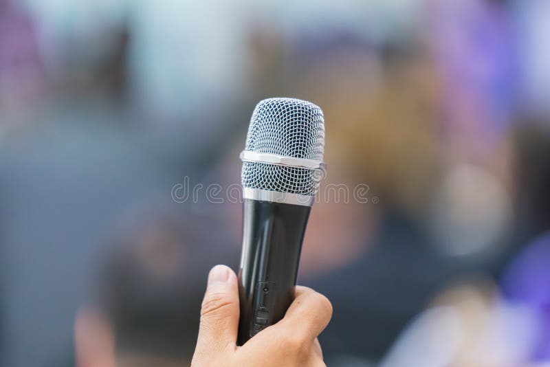 Hand Hold Microphone in Meeting Room for a Conference Stock Photo ...
