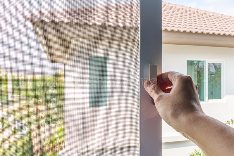 Hand Hold Mosquito Net Wire Screen Handle on House Window Stock Photo ...