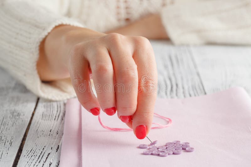 Hand Hold Needle Sew a Button Stock Photo - Image of needlework, woman ...