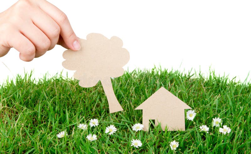 Hand Hold Paper Cut of House Over Green Grass. Stock Photo - Image of ...