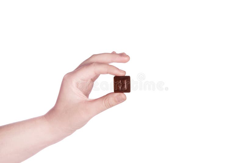Chocolate Pieces in Hand stock photo. Image of fattening - 27504808
