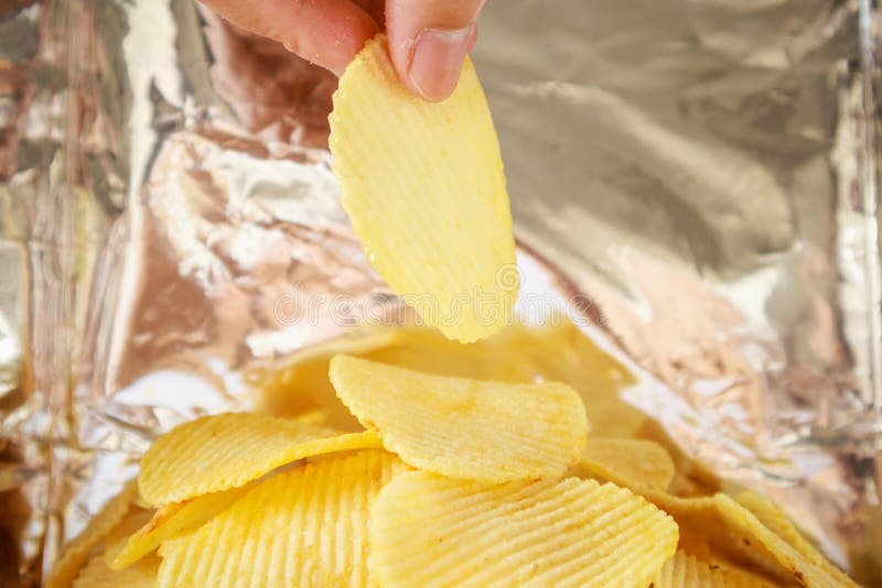 Hand Hold Potato Chips Inside Snack Foil Bag Stock Image - Image of ...