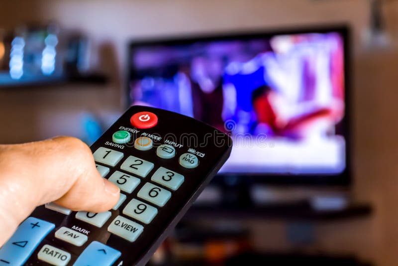 Hand Hold the Remote Control To Change Channesl on Tv Stock Photo ...