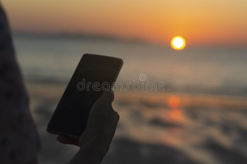 Hand Hold Smart Phone at Sea Sunset Stock Image - Image of sunset ... Hand Hold Smart Phone at Sea Sunset Stock Image - Image of sunset ...