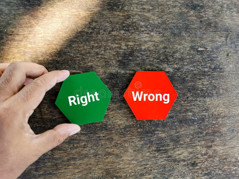 Hand Hold Wooden Hexagon with Texts Right and Wrong. Stock Image ... Hand Hold Wooden Hexagon with Texts Right and Wrong. Stock Image ...