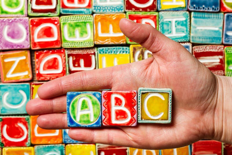 Hand holding abc letters stock photo. Image of communication - 144669352