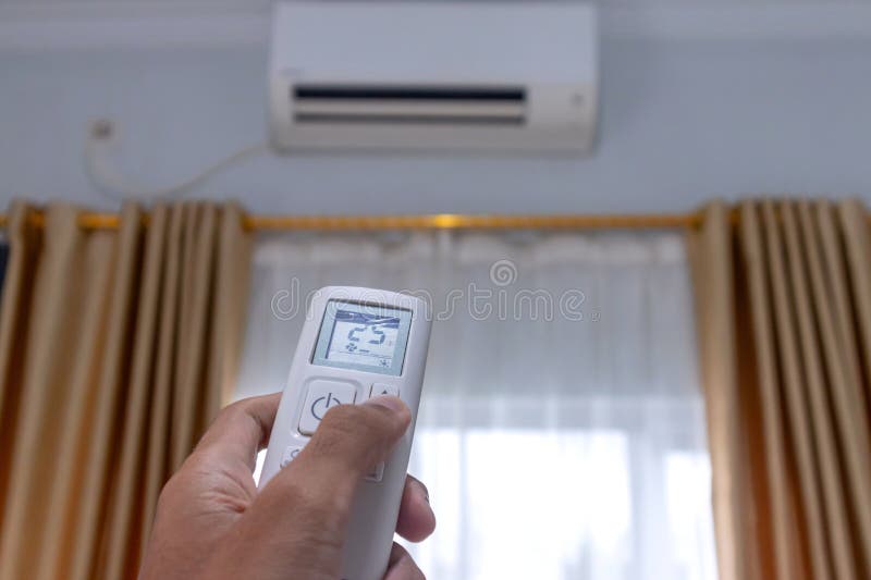 Hand Holding Ac Remote Control Directed Air Conditioner Adjust ...