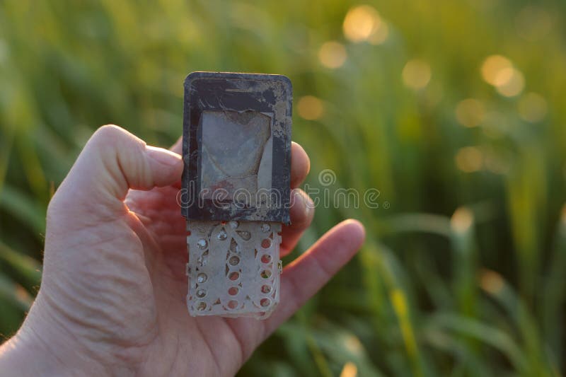 E-waste Recycling - Old, Damaged Cell Phone in Hand. Copy Space for ...