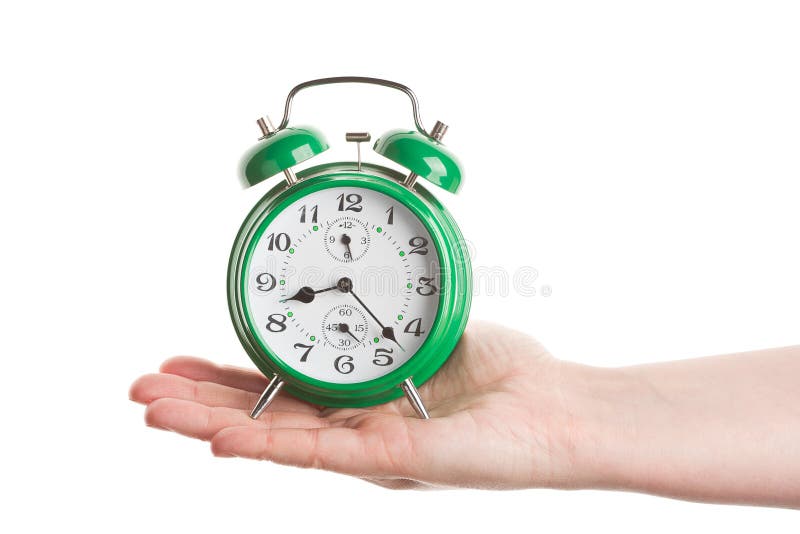 Hand holding alarm clock stock photo. Image of minute - 25814946