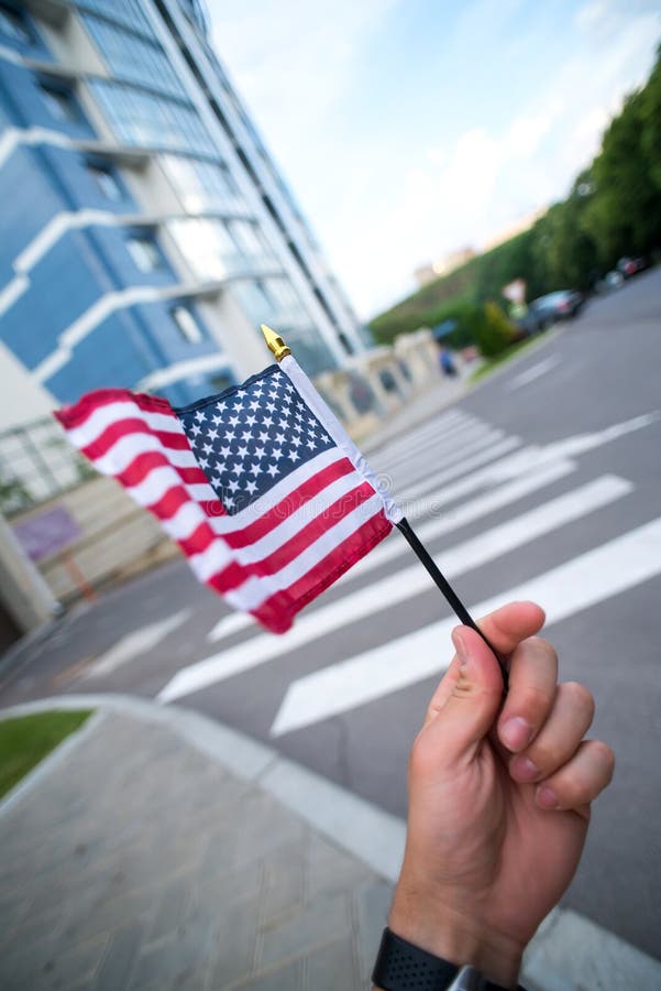 Hand holding american flag stock image. Image of independence - 55392383