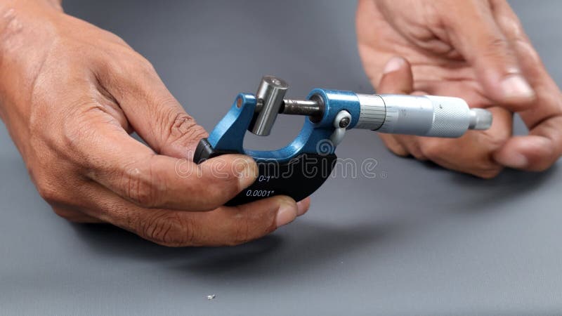 Hand Holding Analogue Micrometer or Diff Micrometer Quality Control ...