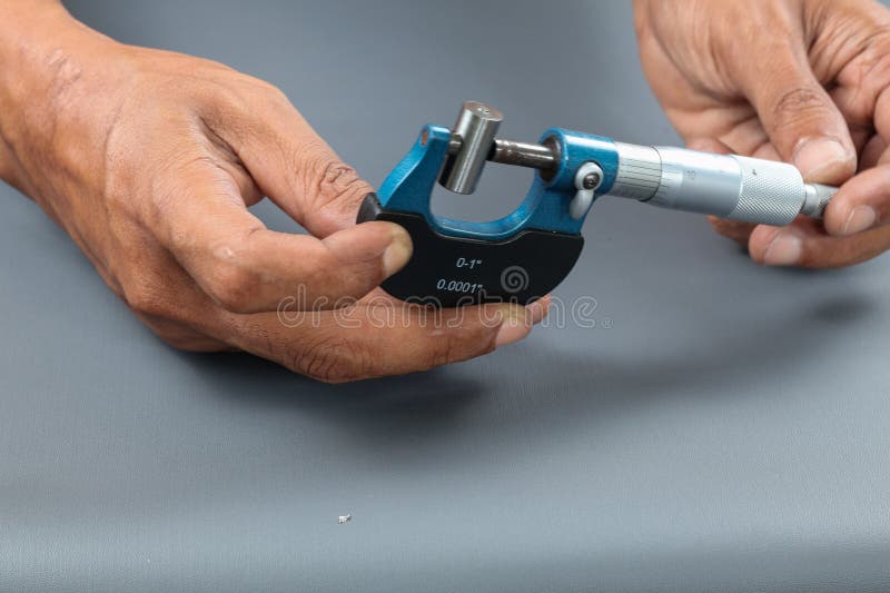 Hand Holding Analogue Micrometer or Diff Micrometer Quality Control ...