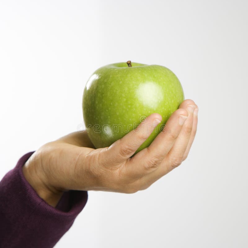 Hand holding apple. stock photo. Image of years, middle - 2425958