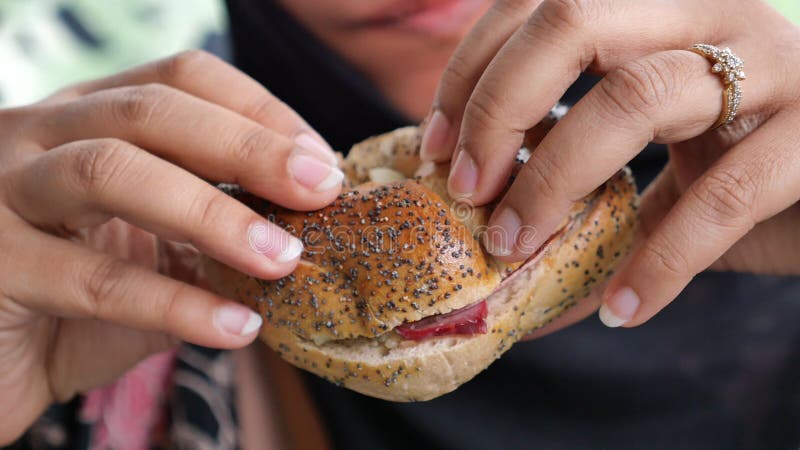 Hand Holding Beef Burger on Table Close Up Stock Footage - Video of ...