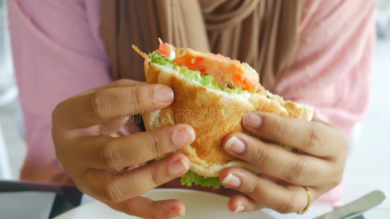 Hand Holding Beef Burger on Table Close Up Stock Footage - Video of ...