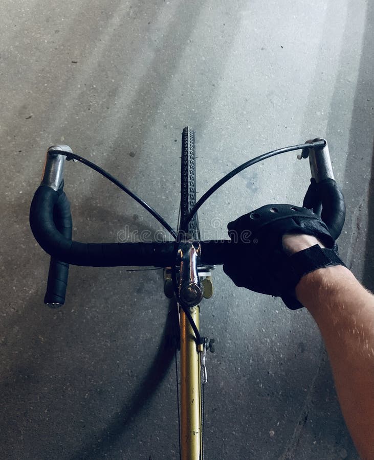 Hand holding bicycle stock photo. Image of biking, nature - 229100936