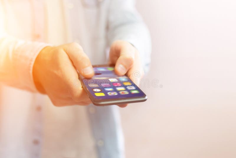 Hand Holding Black Smartphone with Operating System Screen Stock Photo ...
