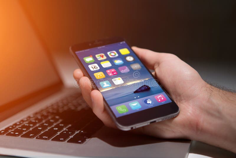 Hand Holding Black Smartphone with Operating System Screen Stock Image ...