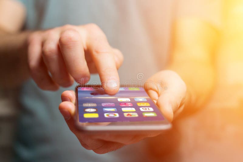 Hand Holding Black Smartphone with Operating System Screen Stock Photo ...